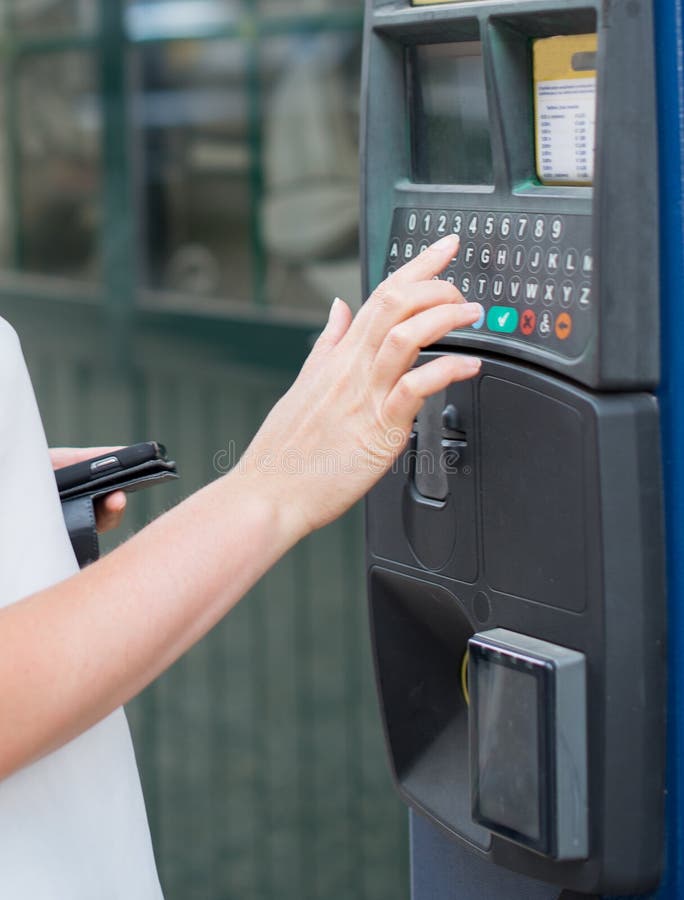 Woman Using Parking Machine. Stock Photo - Image of insert, adult ...
