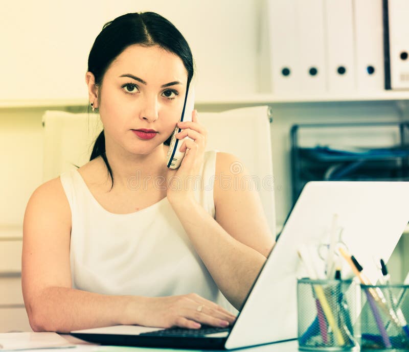 Woman Using Phone in Office Stock Image - Image of laptop, computer ...