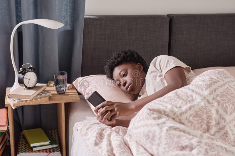 Woman Using Phone before Sleeping Stock Photo - Image of cheerful ...