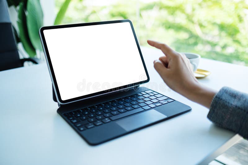 A Woman Using and Pointing Finger at Tablet Pc with Blank Desktop White ...