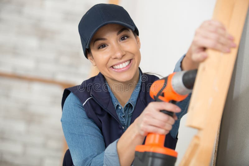 Woman Using Power Tool on Wooden Door Frame Stock Photo - Image of ...