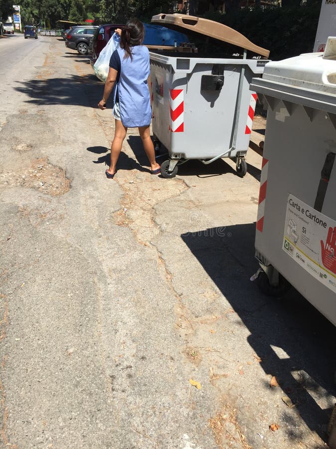 Woman using recycling bin editorial stock image. Image of curbside ...