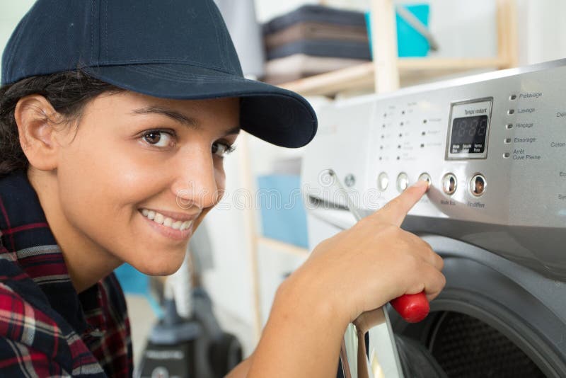 Woman Using Driver in Washing Machine Stock Photo - Image of heat ...