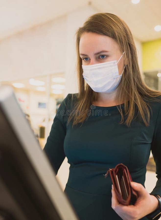 Woman Using a Self-service Terminal Stock Photo - Image of covid ...