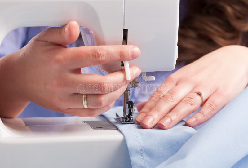 Woman using sewing machine stock photo. Image of needle - 30555956