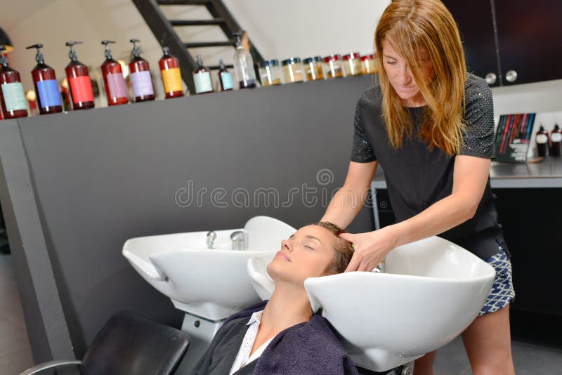 Woman using shampoo stock image. Image of female, sink - 222652233