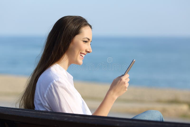 Woman Using a Smart Phone Outdoors on the Beach Stock Image - Image of ...