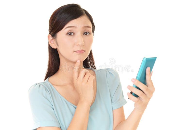 Woman using a smart phone stock image. Image of face - 59124613