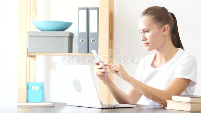 Woman Using Smartphone Applications at Work in Office Stock Image ...