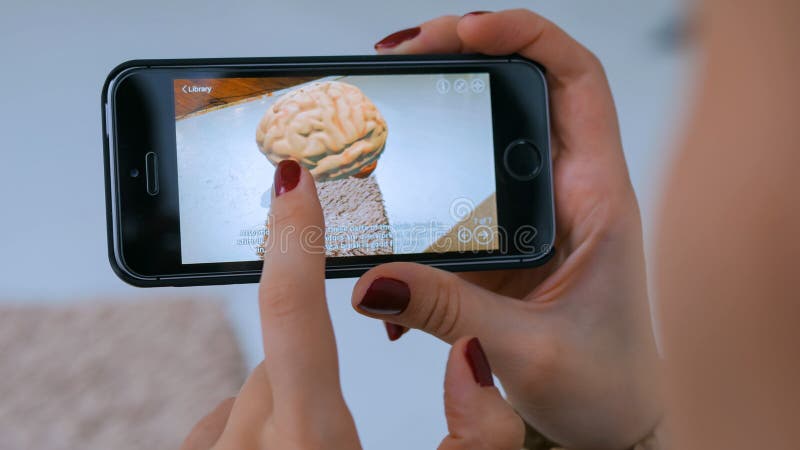 Woman Using Smartphone with Augmented Reality App and Exploring Virtual ...