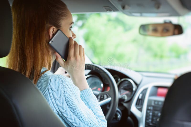 Woman Using Smartphone while Driving a Car Stock Image - Image of ...