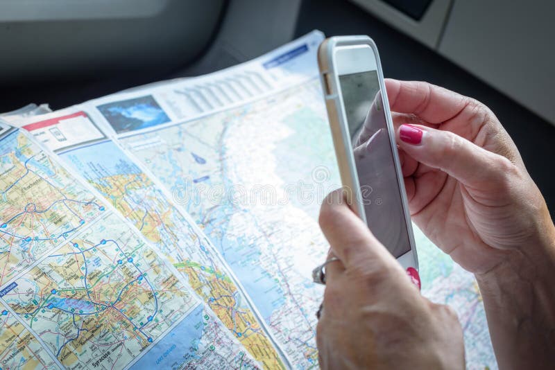 Woman Using Smartphone and Map To Plan Trip Stock Photo - Image of fold ...