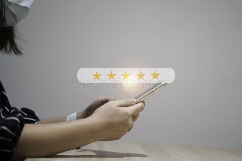 Woman Using Smartphone for Select Five Stars for Client Evaluation and ...