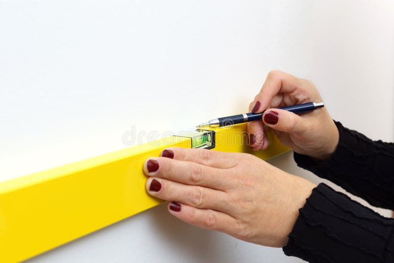 A Woman Using a Spirit Level for Home Work Stock Image - Image of tool ...