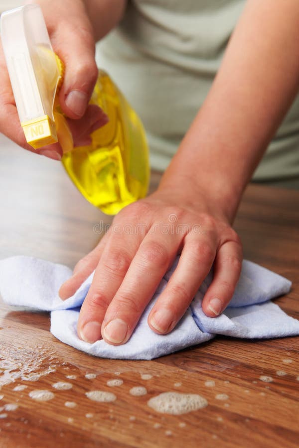 Woman Using Spray To Clean Wooden Surface Stock Photos - Free & Royalty ...