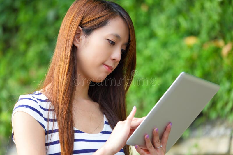 Casual Woman Using Tablet PC Outdoors Stock Photo - Image of focus ...