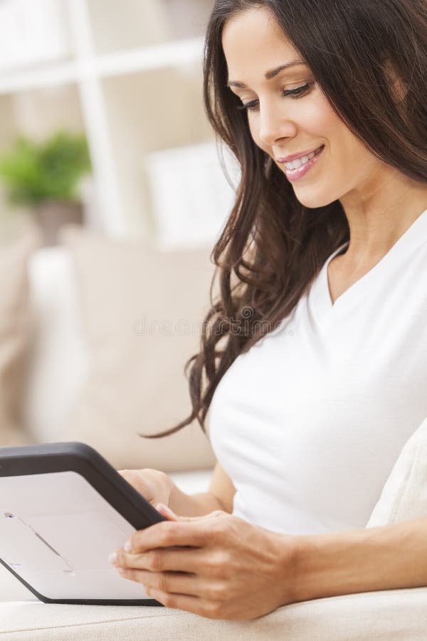 Young Woman Using Tablet Computer at Home Stock Photo - Image of ... Young Woman Using Tablet Computer at Home Stock Photo - Image of ...