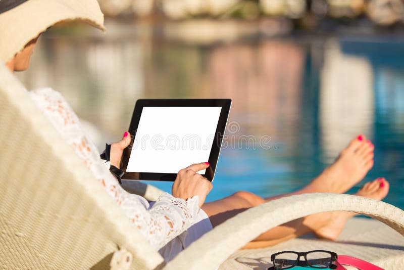 Woman Using Tablet Computer by the Pool Stock Photo - Image of device ...