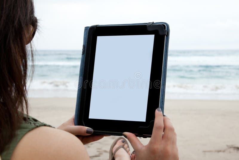 Woman Using Tablet Device while on a Beach Stock Image - Image of ...