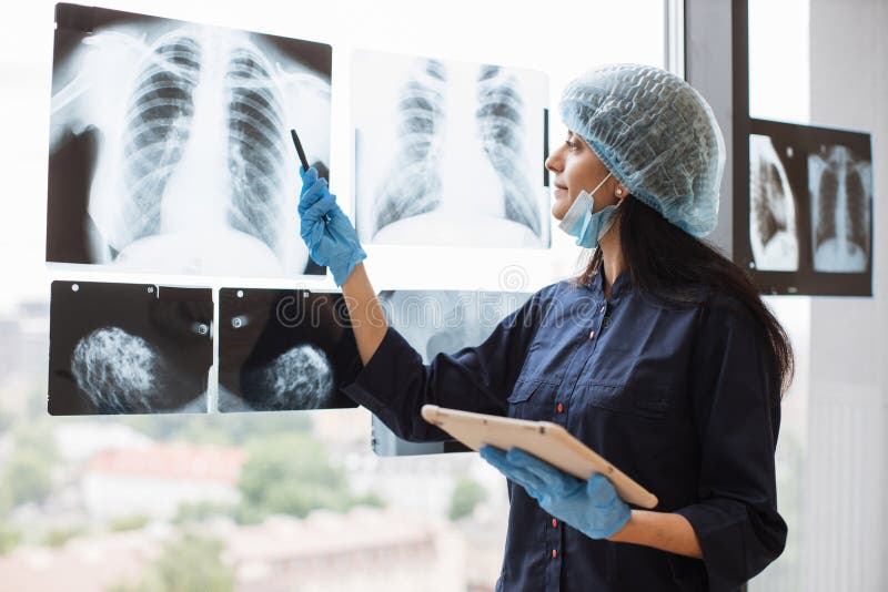 Woman Using Tablet while Examining Chest X-ray at Hospital Stock Photo ...
