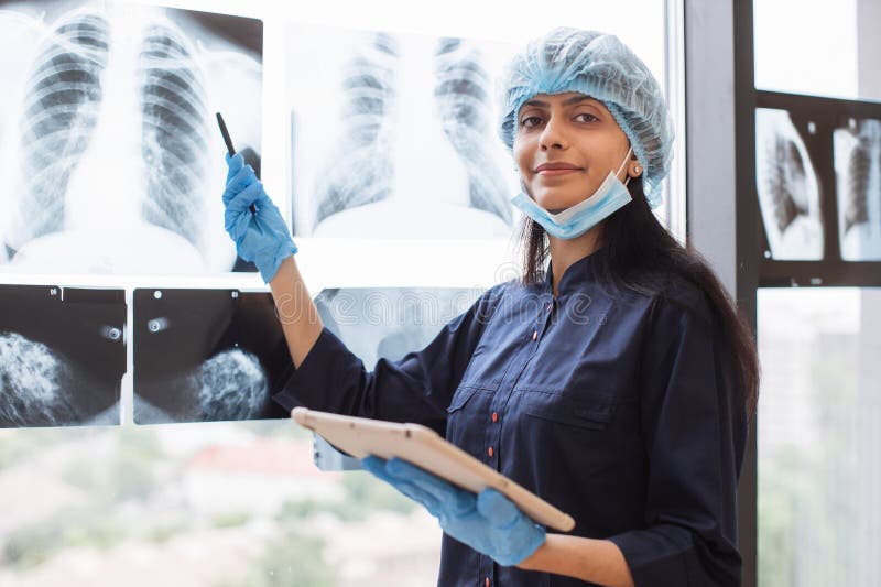 Woman Using Tablet while Examining Chest X-ray at Hospital Stock Image ...