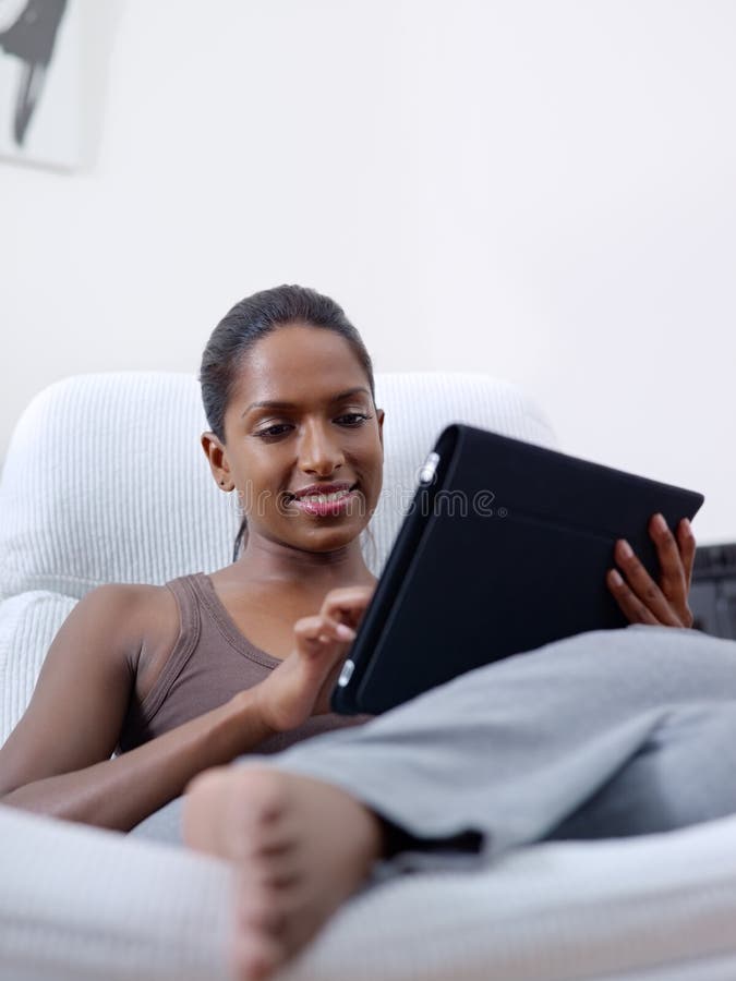 Woman Using Tablet Pc at Home Stock Photo - Image of device, person ...