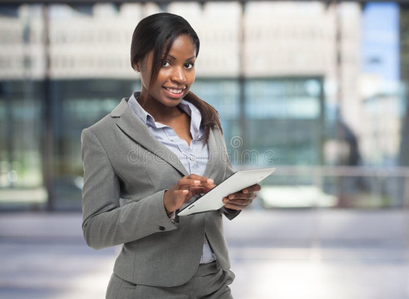 Woman using a tablet stock image. Image of american, afro - 45014257