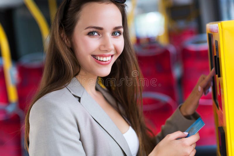 Woman Using Ticket Machine on Bus Stock Photo - Image of person, people ...