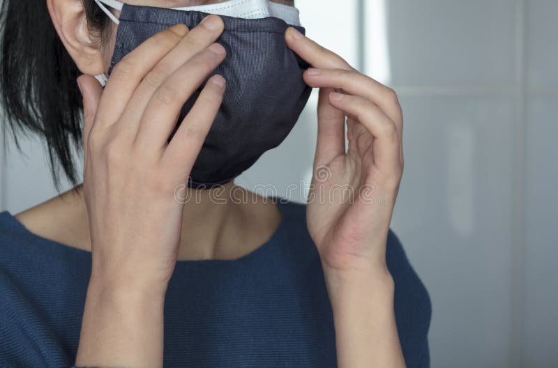Woman Using Two Face Masks at the Same Time Stock Image - Image of ...