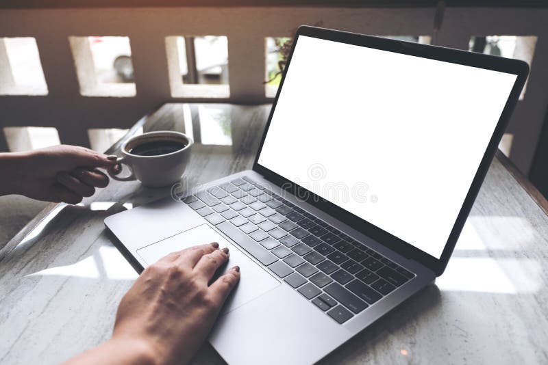 A Woman Using and Typing on Laptop with Blank White Screen while ...