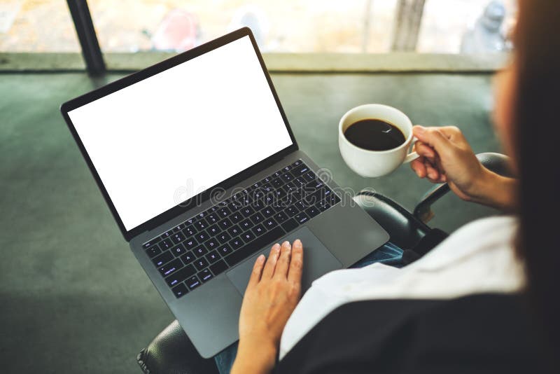 A Woman Using and Typing on Laptop Computer with Blank White Desktop ...