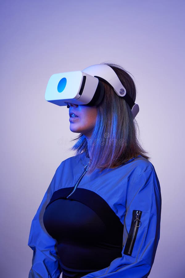 Woman is Using Virtual Reality Headset. Concept of Virtual, Augmented ...