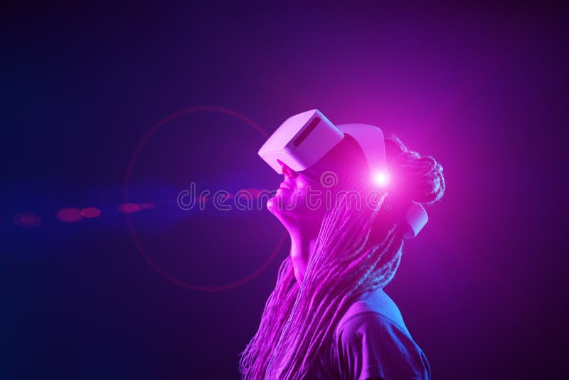 Woman is Using Virtual Reality Headset. Neon Light Studio Portrait ...