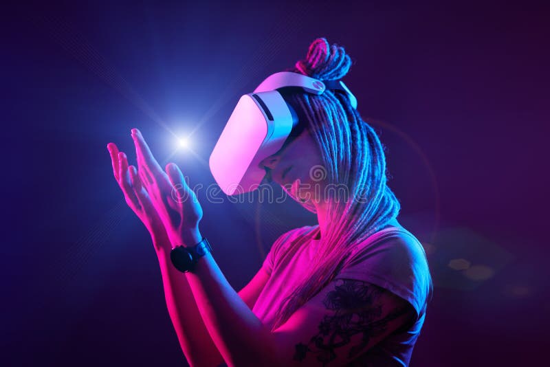 Woman is Using Virtual Reality Headset. Neon Light Studio Portrait ...