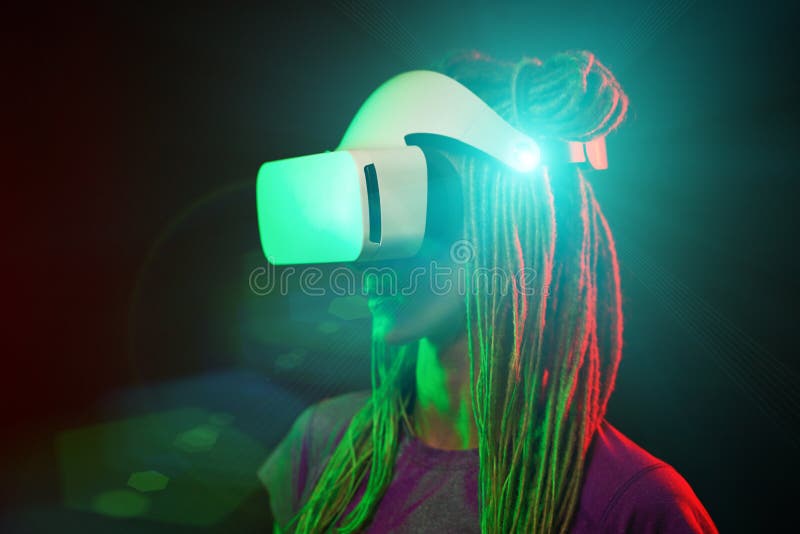 Woman is Using Virtual Reality Headset. Neon Light Studio Portrait ...