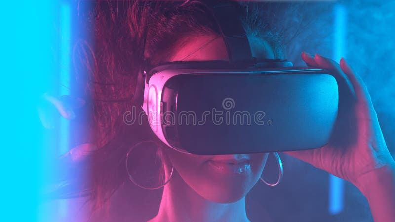 Woman is Using Virtual Reality Headset. Neon Light Studio Portrait ...
