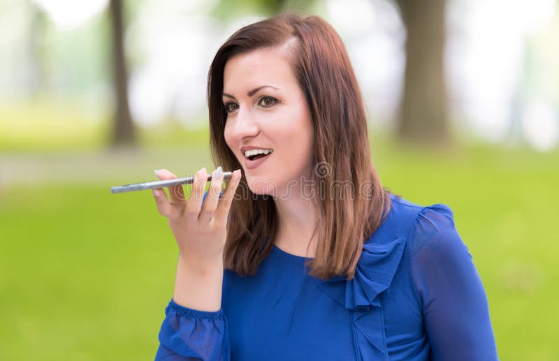 Woman Using the Voice Input on Her Smartphone Stock Image - Image of ...