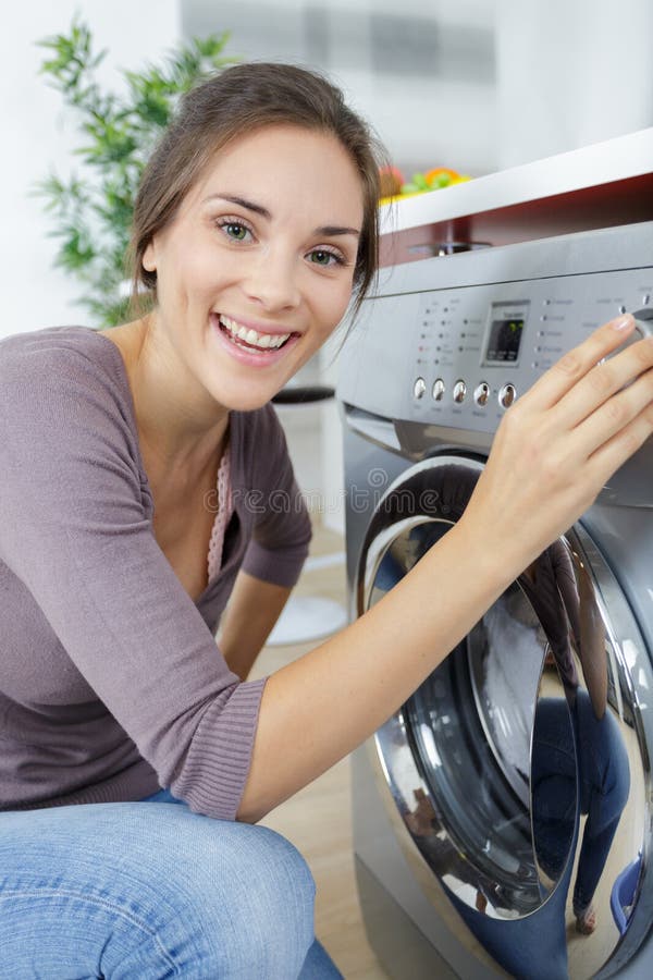 Woman Using Washing Machine at Home Stock Image - Image of cloth, adult ...