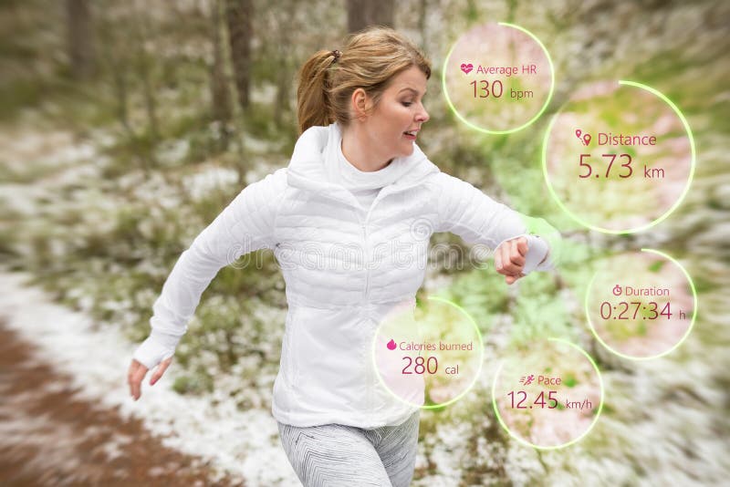 Woman Using Wearable Tech during Running Workout Outdoors Stock Photo ...