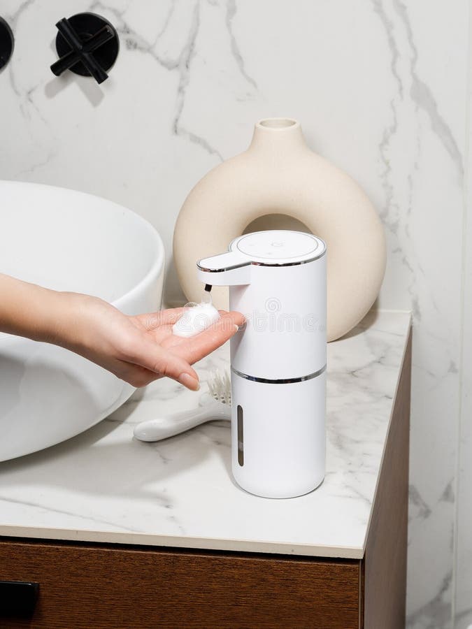 Woman Using White Automatic Soap Dispenser in Bathroom Stock Image ...