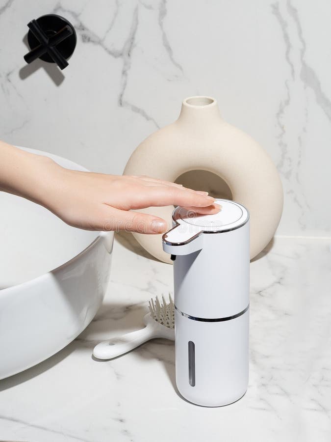 Woman Using White Automatic Soap Dispenser in Bathroom Stock Image ...