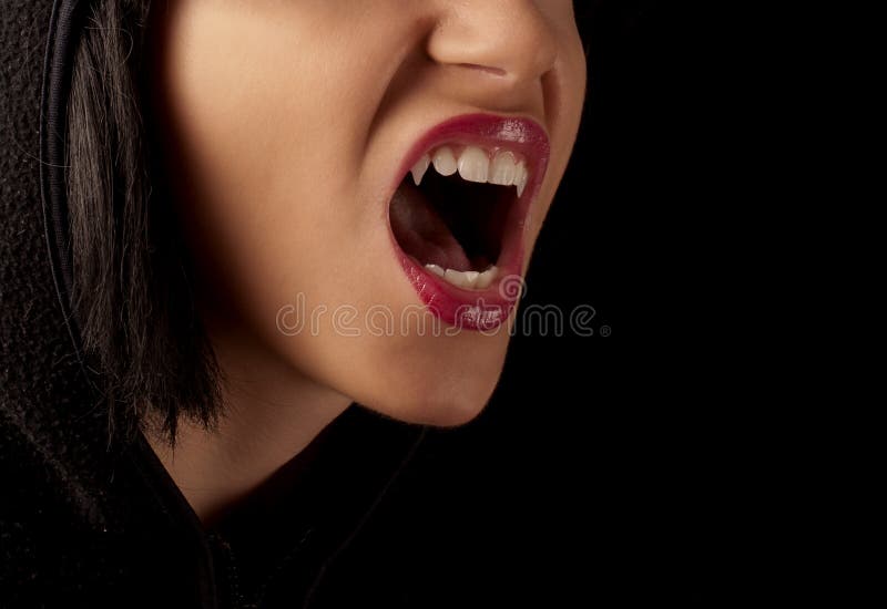 Woman Vampire With Fangs On A Black Background Stock Photo - Image of ...