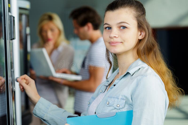 Woman at vending machine stock image. Image of equipment - 188228243