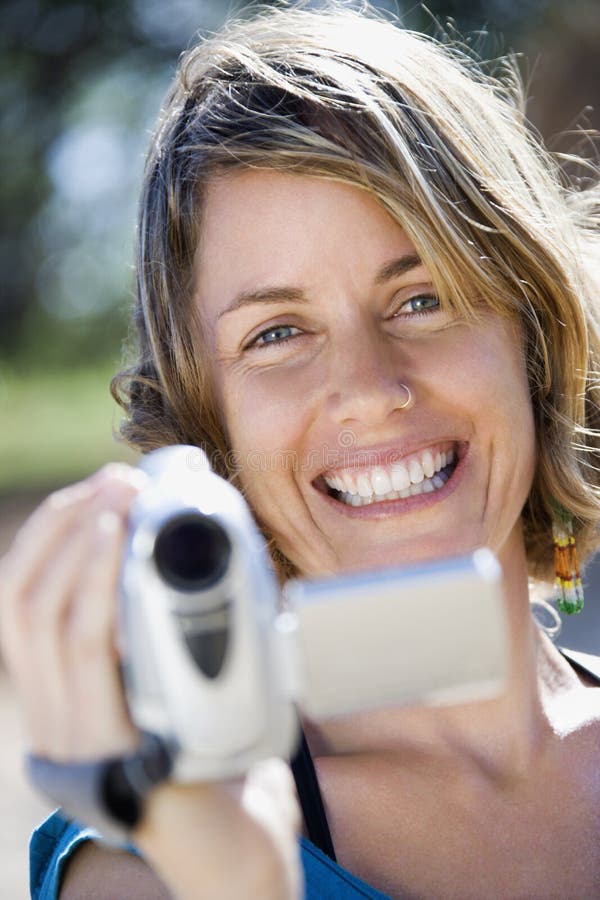 Woman with video camera. stock image. Image of portrait - 2431847