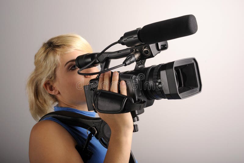 Woman with video camera stock image. Image of suspense - 7149345