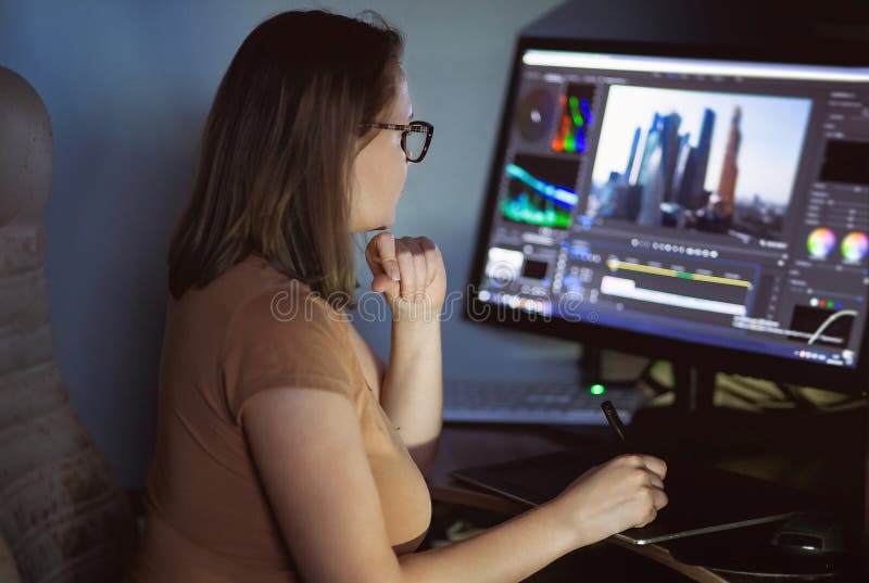 Woman Video Creator Mounts Video at Desktop. Home Workstation Stock ...