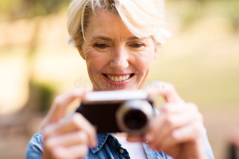 Woman Viewing Pictures Camera Stock Image - Image of female, outside ...