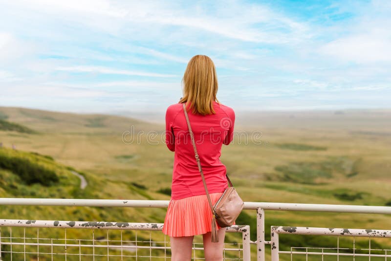 A Woman Viewing the Sights at Head Smashed in Buffalo Jump in Alberta ...