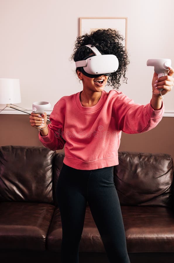 Woman with VR Goggles and Controllers in Living Room Stock Photo ...