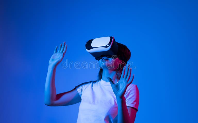 Woman in VR Headset Looking Up at the Objects in Virtual Reality. Young ...